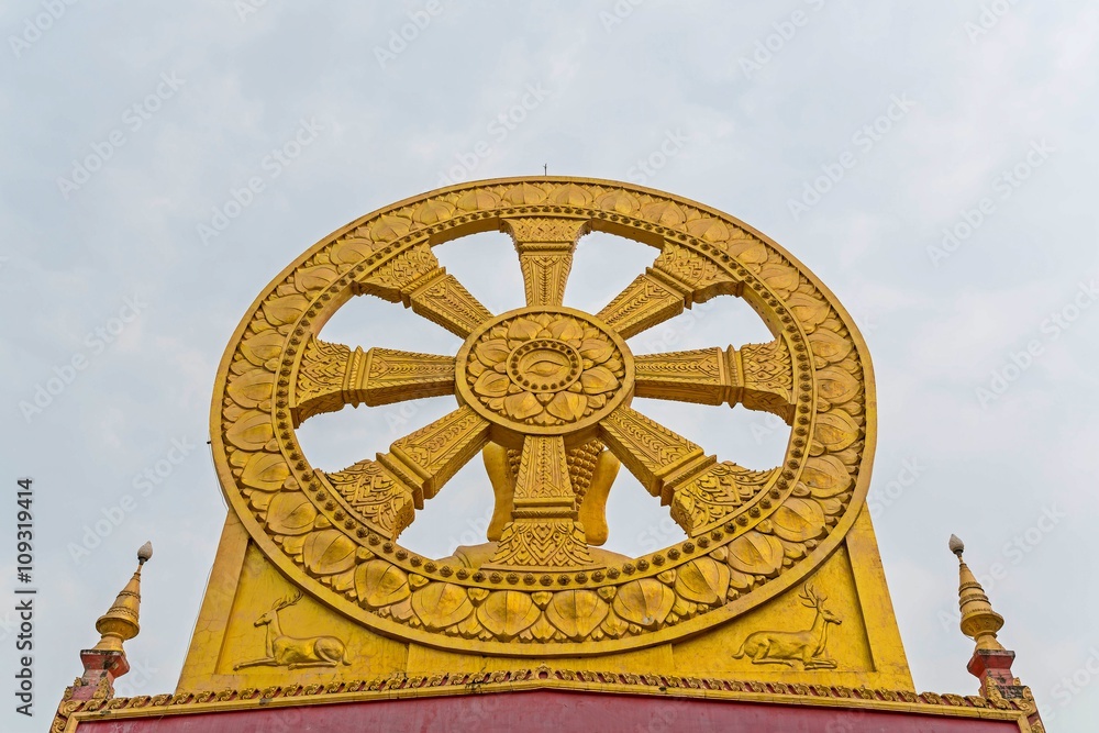 Golden Wheel of Dhamma on sky clouds (Dharmachakra ) Thai Art in public ...
