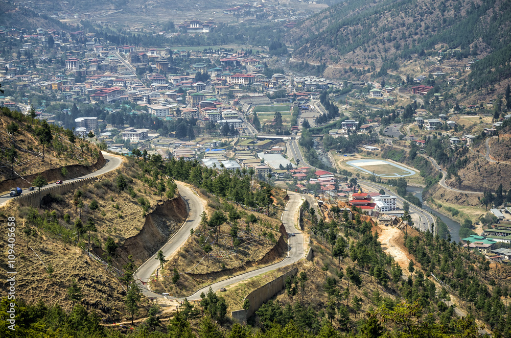 The winding hill road and aerial view of Thimphu city in Bhutan ...
