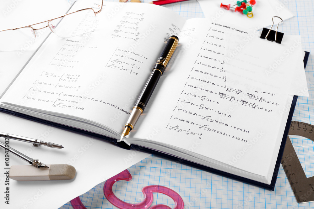 School supplies and textbook on mathematics close up Stock Photo ...