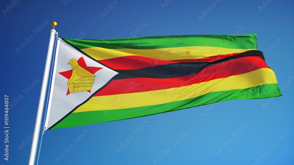 Zimbabwe flag waving in slow motion against clean blue sky, seamlessly ...