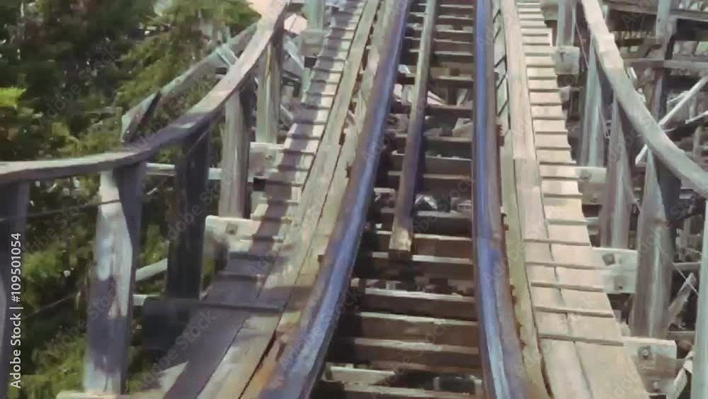 Riding on roller coaster in amusement park. Extreme. Joyfulness. Summer ...
