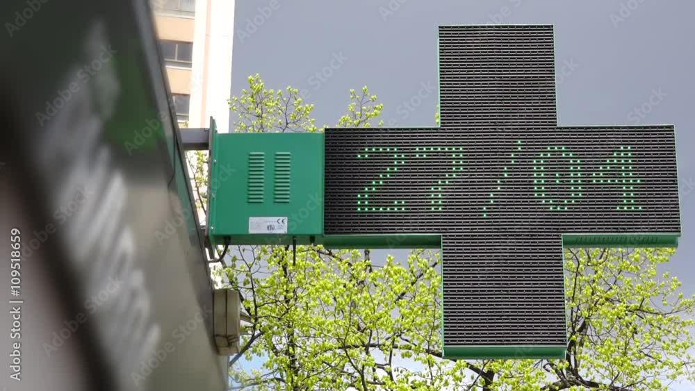 LED Pharmacy Sign Green Cross Board Time Lapse. The green cross is ...