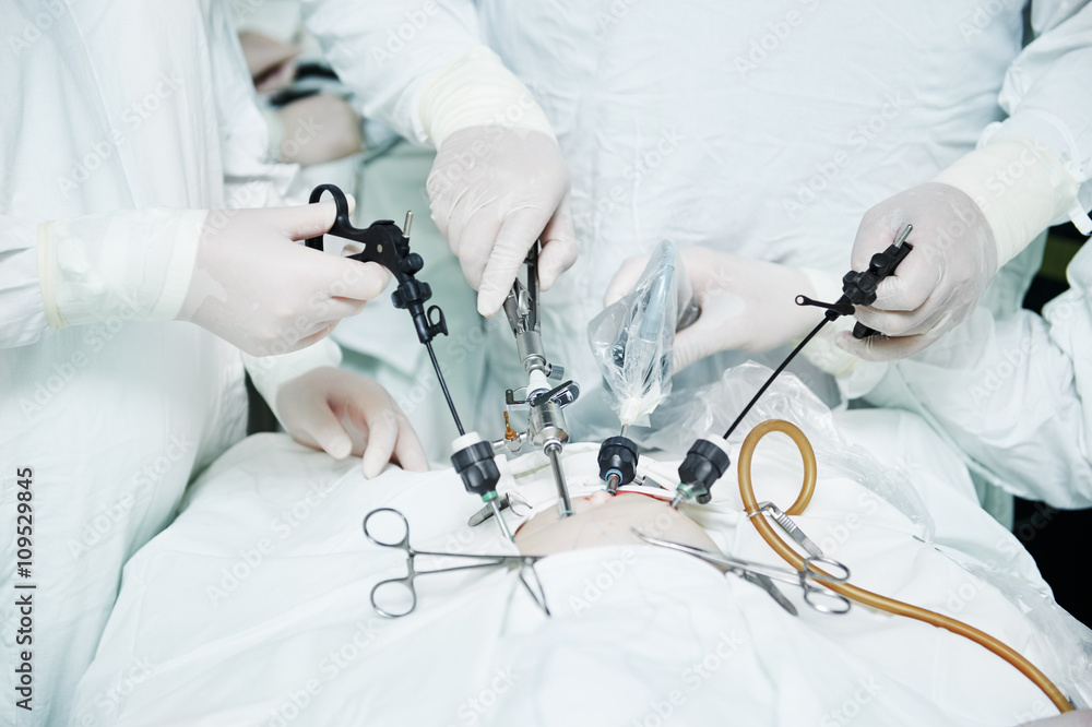 surgeons team hands during laparoscopic abdominal operation in child ...