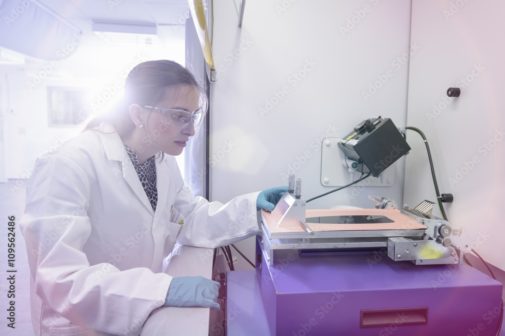 Scientist making lithium ion battery samples in battery research ...