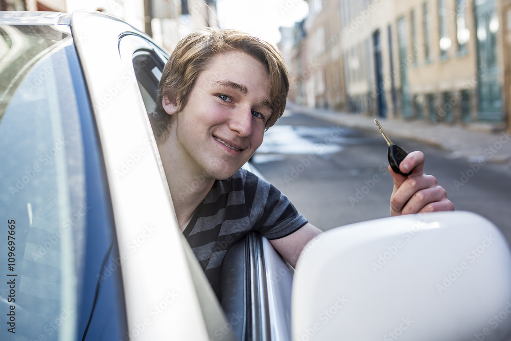 Teenage boy and new driver behind wheel of his car Stock Photo | Adobe ...