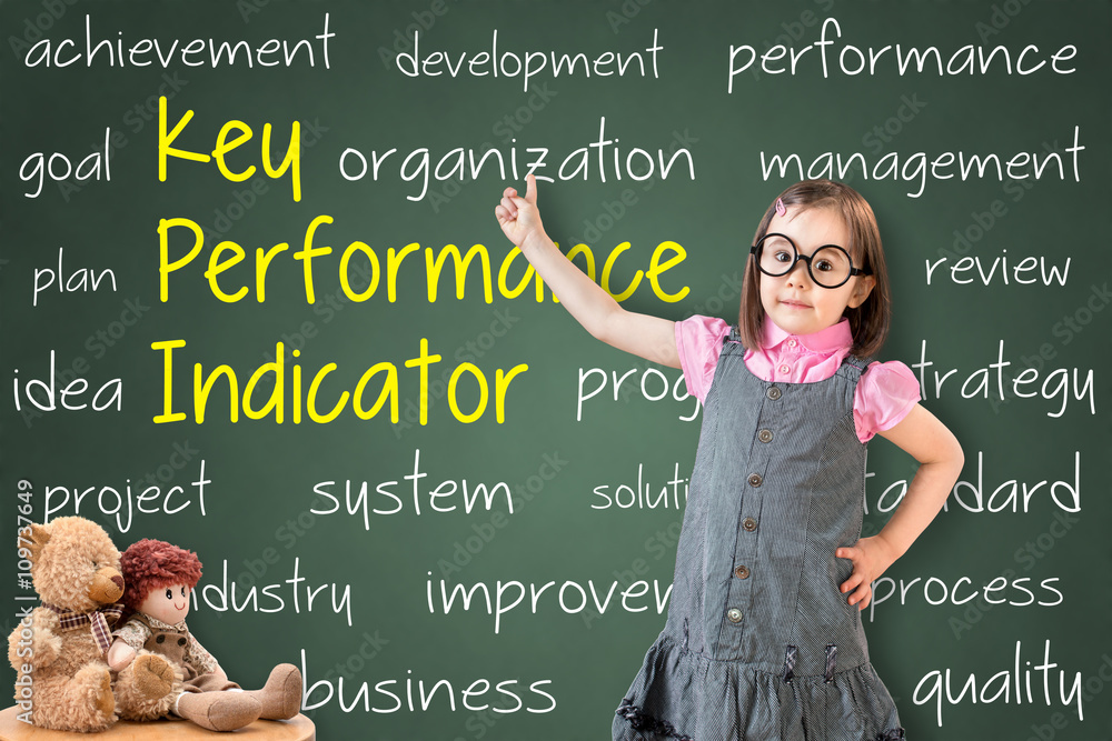 Cute little girl wearing business dress and showing key performance ...