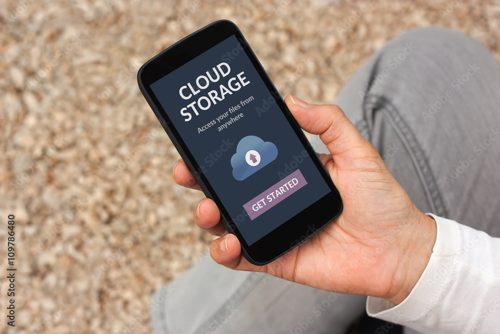 Hand holding smart phone with cloud storage app concept on screen. All ...