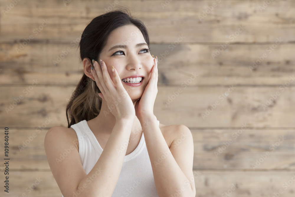 Young women are laughing against hand on the cheek Stock Photo | Adobe ...
