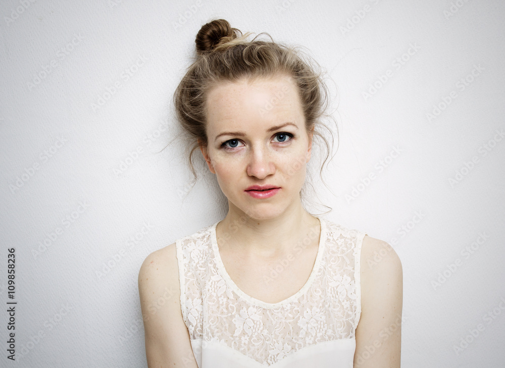 Young woman looking reproachfully into the camera. Stock Photo | Adobe ...