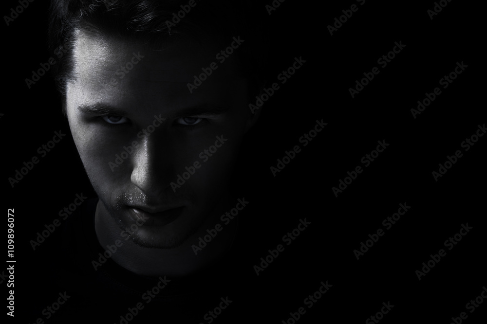 dark young adult man portrait fade in black background Stock Photo ...