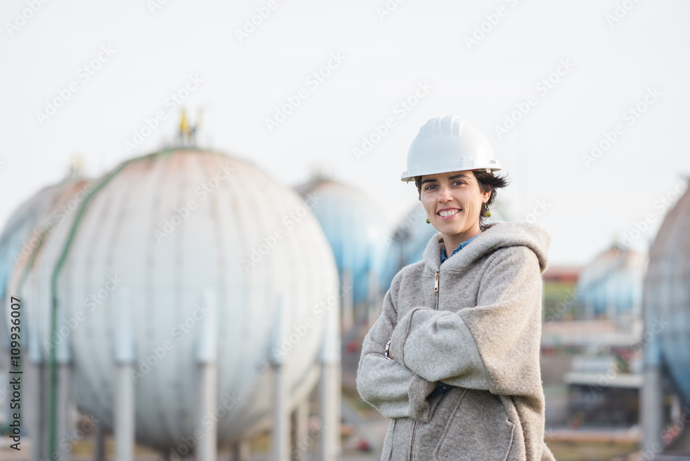 successful independent engineer smiling woman on industrial area with ...
