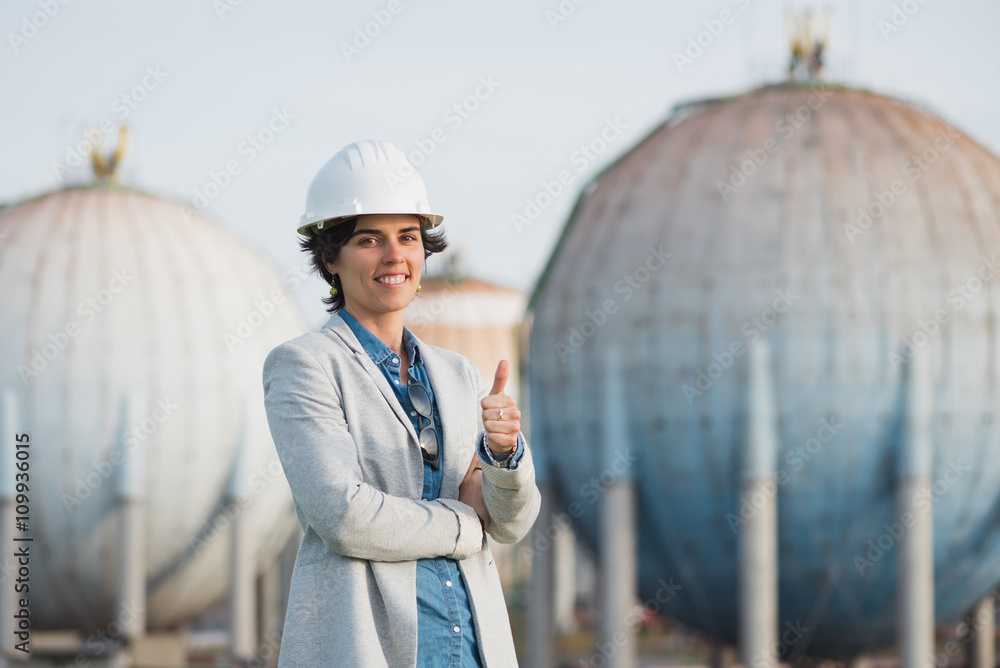 successful independent engineer smiling woman on industrial area with ...