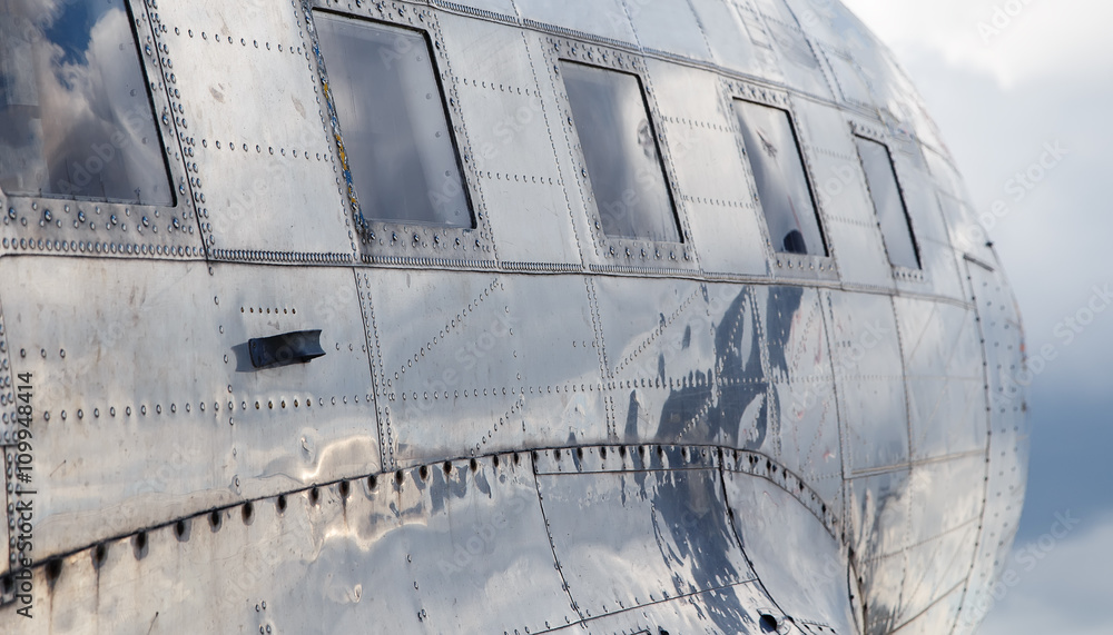 square windows of the old airplane sunny day reflection of the sky in ...