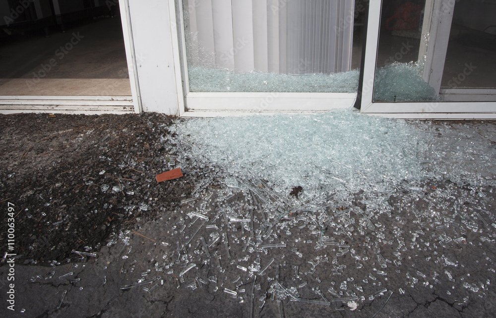 Broken glass in a driveway after a home invader smashed it in to grain ...