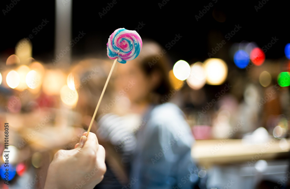Hand holding loli pop candy Stock Photo | Adobe Stock