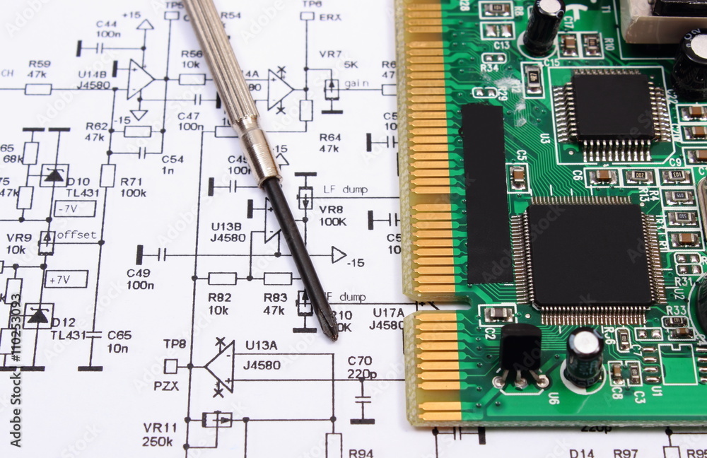 Printed circuit board and precision tools on diagram of electronics ...