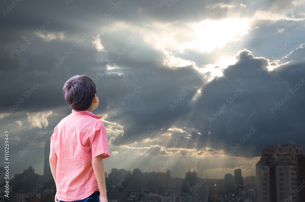 Little boy look up high in the sky Stock Photo | Adobe Stock