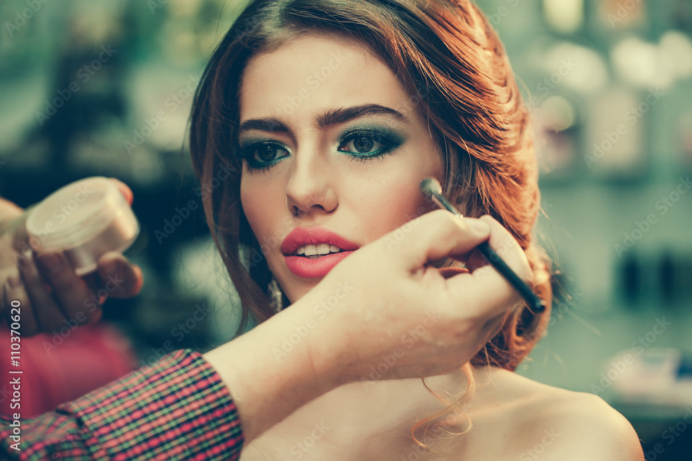 Pretty girl making makeup Stock-Foto | Adobe Stock