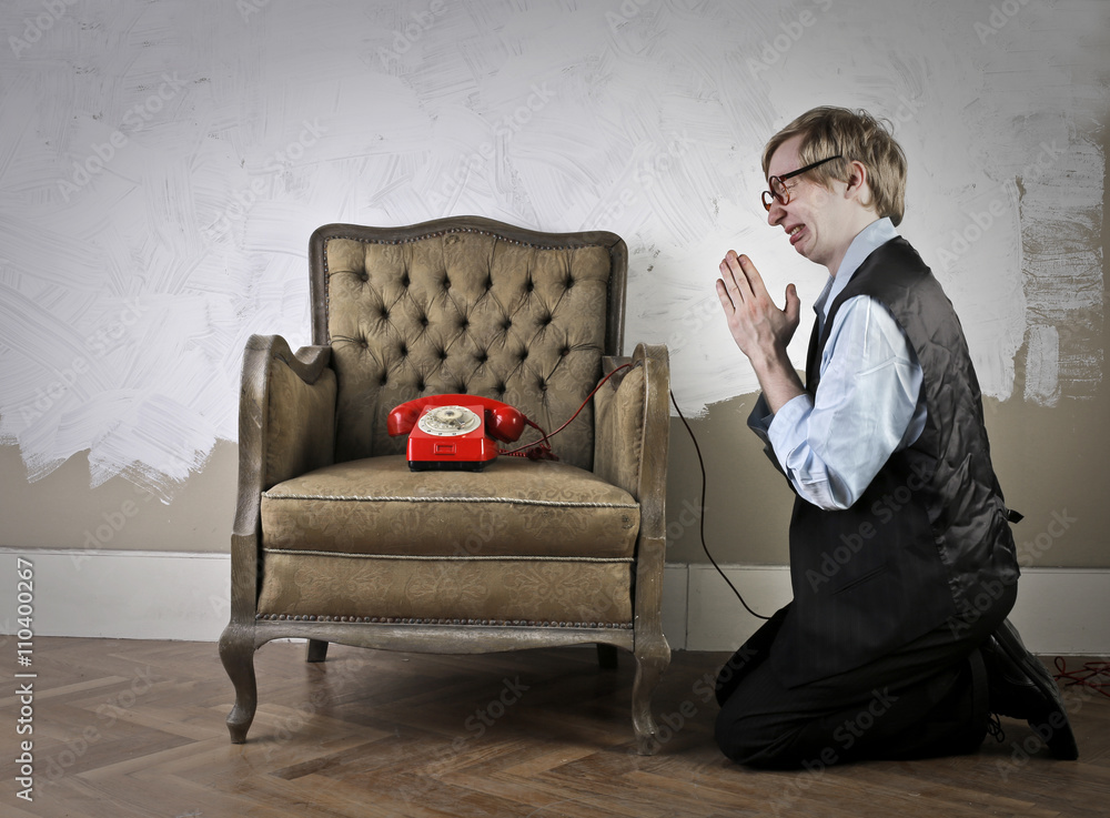 Praying for a call Stock Photo | Adobe Stock