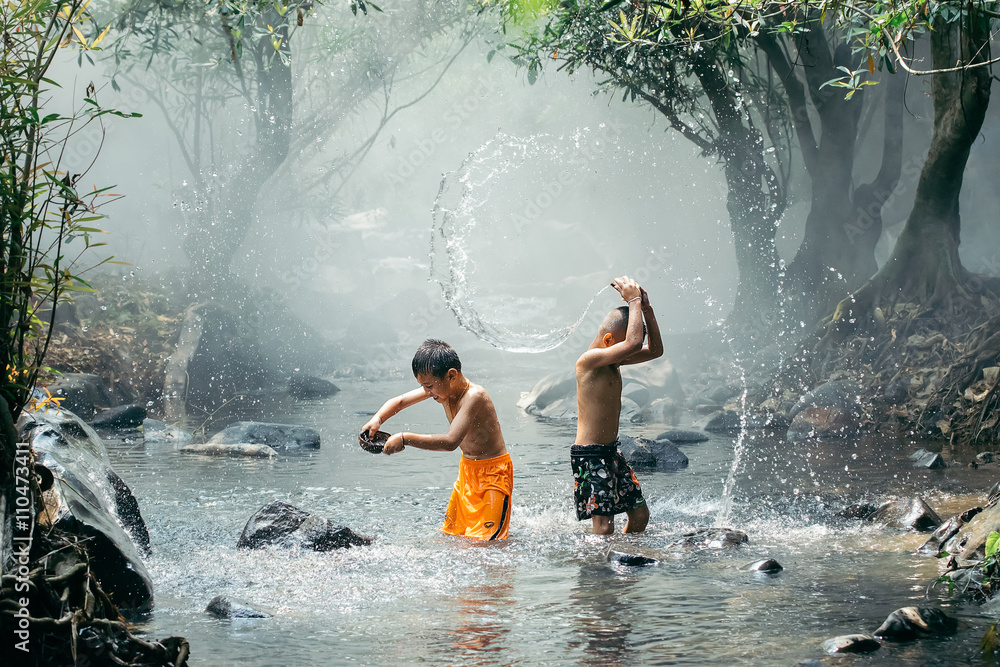 kids playing water Stock Photo | Adobe Stock