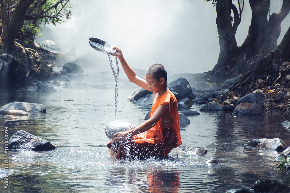 monk play water Stock Photo | Adobe Stock