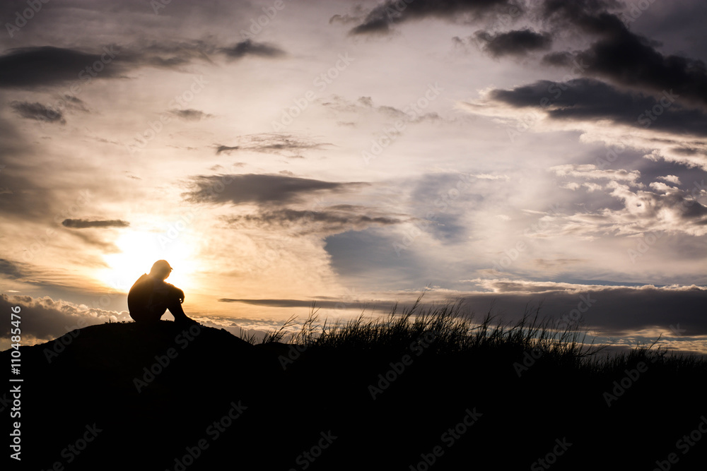 Sad boy silhouette worried on the meadow at sunset ,Silhouette c Stock ...
