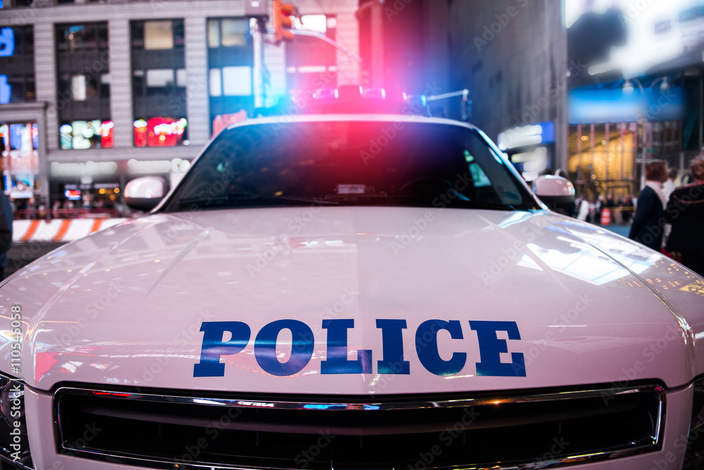 A police car rushes to the emergency call with lights turned on in the ...