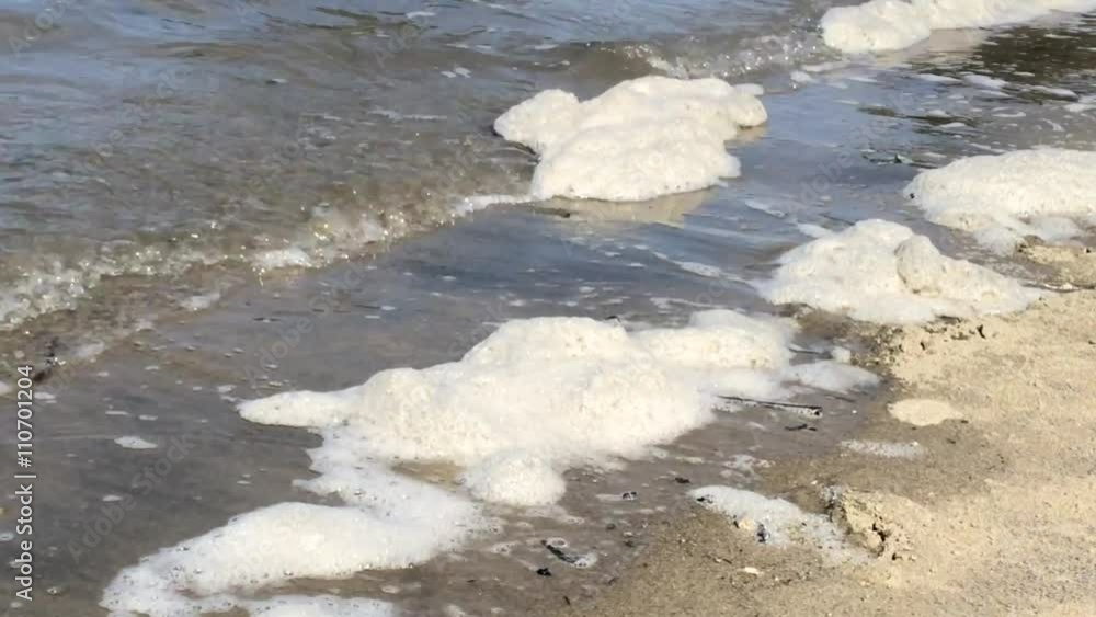 HD Video of Sea foam, created by the agitation of seawater when it ...
