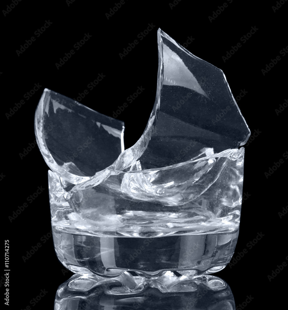 Broken glass beaker isolated on black background. Stock Photo | Adobe Stock