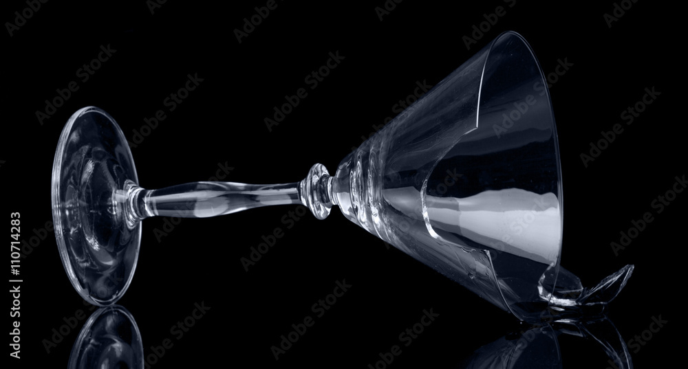 Broken glass tumbler cocktail isolated on black background. Stock Photo ...