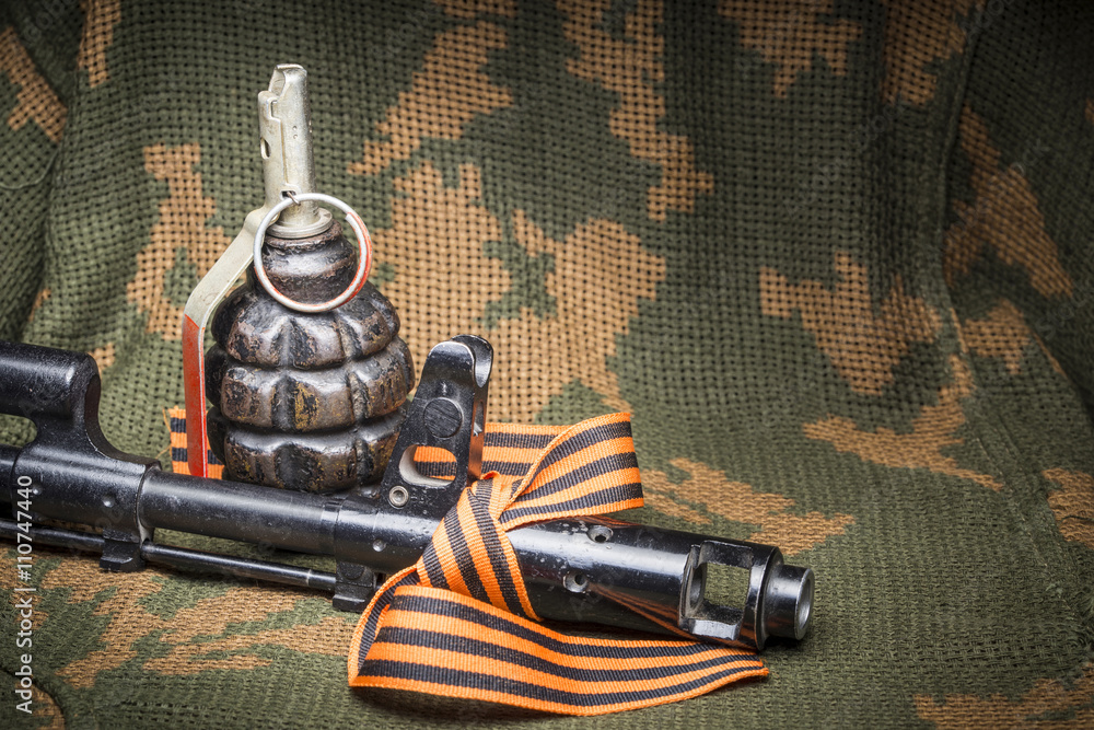 Fragmentation grenade, and Kalashnikov rifle, with St. George ri Stock ...