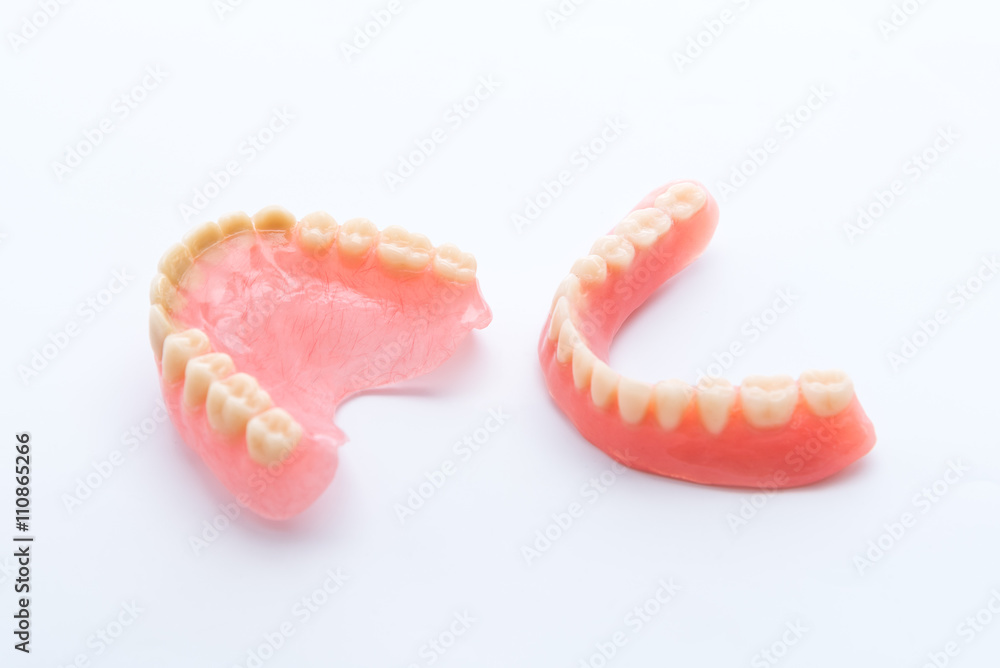 Full denture on white background Stock Photo | Adobe Stock