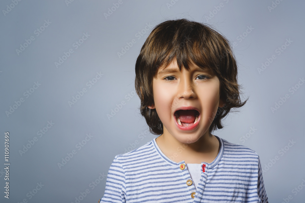 Closeup crying boy with worried stressed expression on gray background ...