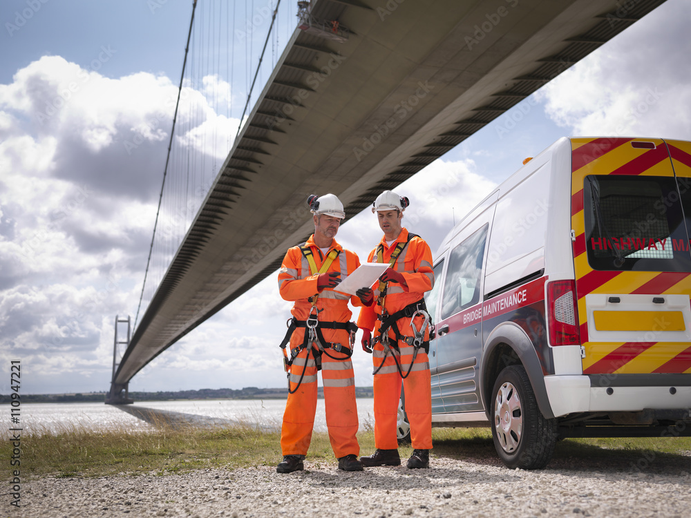 Bridge workers and support truck under suspension bridge. The Humber ...