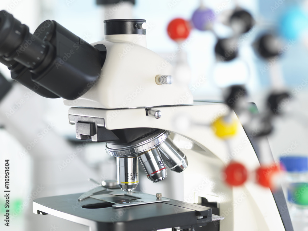 Microscope viewing sample with a ball and stick molecular model ...