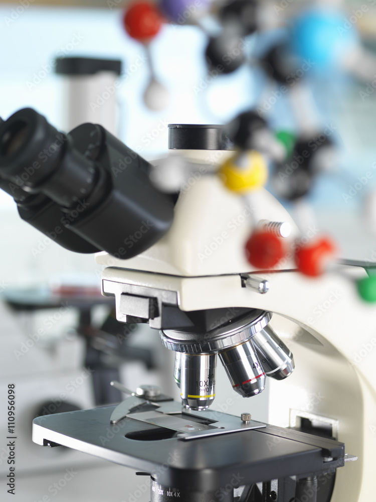 Microscope viewing sample with a ball and stick molecular model ...