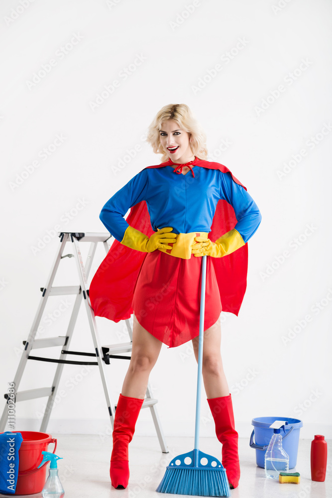 Energetic superwoman ready to clean the house Stock-Foto | Adobe Stock