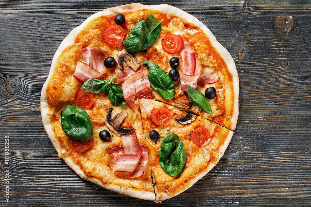 Top view of Italian rustic PIZZA mushrooms, basil, tomato, olives and ...