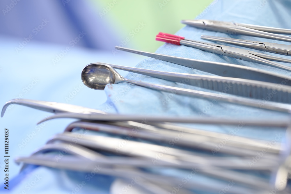 Surgical instruments during an operation macro Stock Photo | Adobe Stock