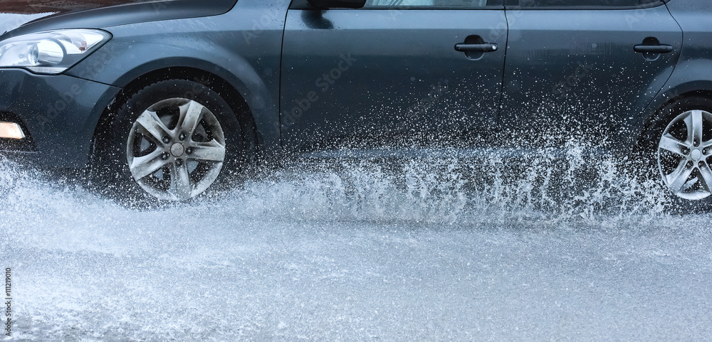 car rain puddle splashing water Stock Photo | Adobe Stock