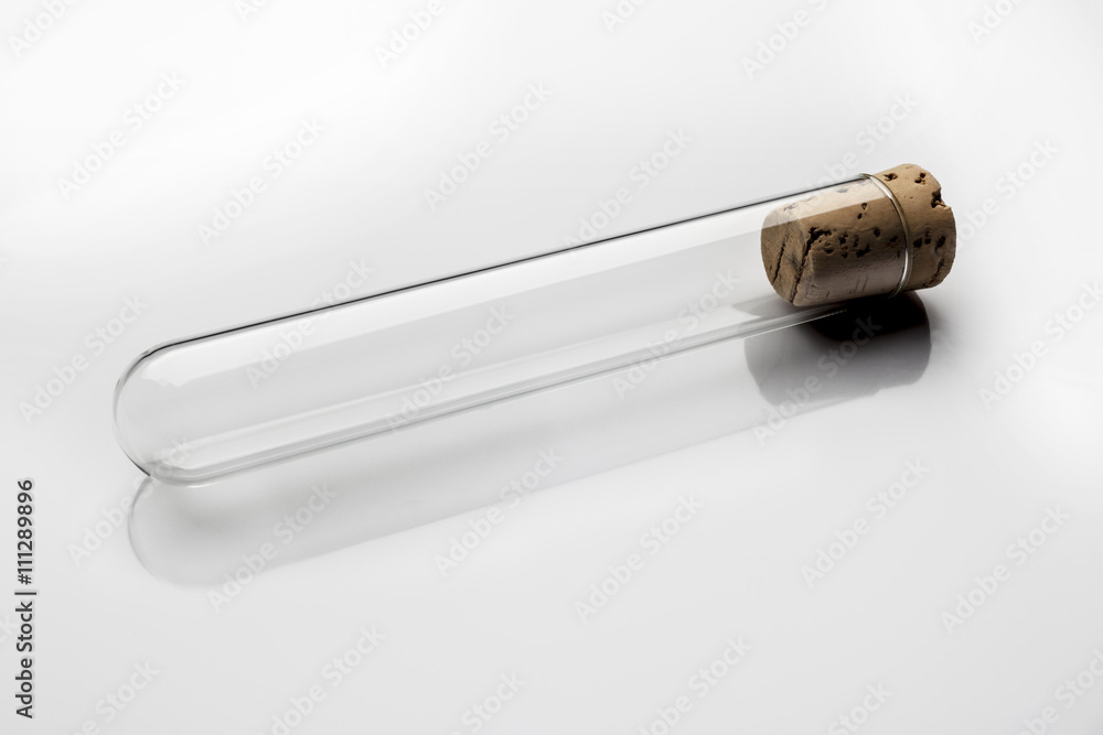 Two empty glass transparent test tube closed with cork on white ...