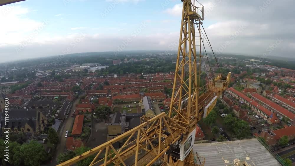 Aerial bird view of tower building crane stunt drone fly through and ...