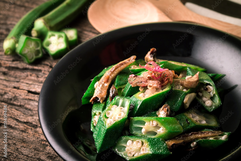 Stir Fried Okra with small fish Asian style on wooden surface in Stock ...