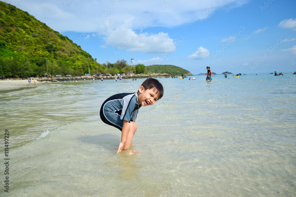 The boys are happy and fun to see the ocean for the first time. Stock ...