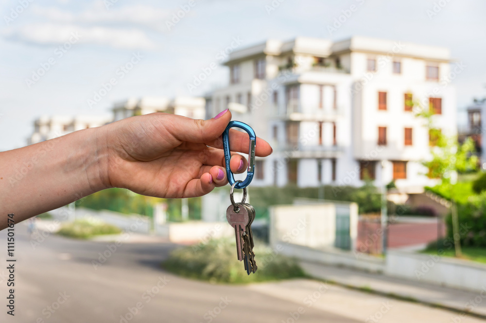 Real estate agent giving house keys to a new property owner Stock Photo ...