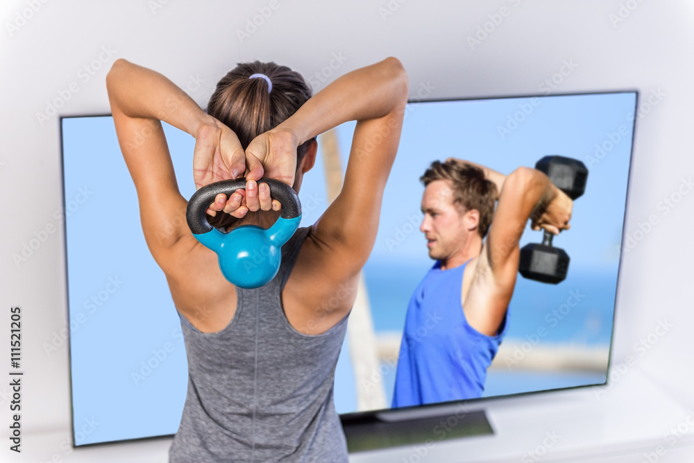 Fitness at home woman working out watching tv. Back of a young sporty ...