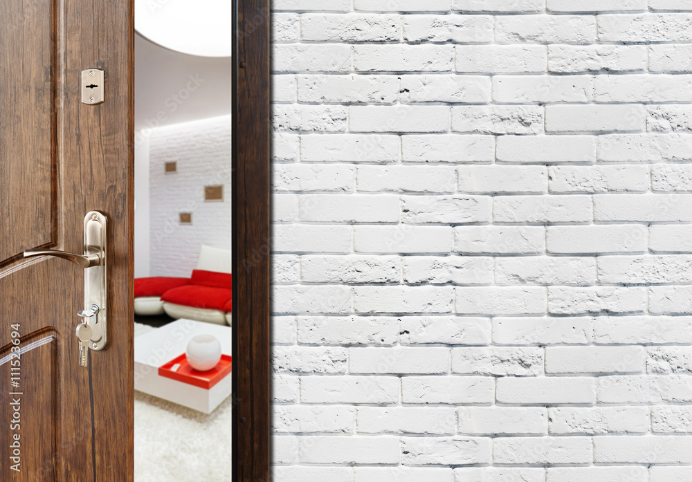 Half open door of a modern living room closeup. Stock Photo | Adobe Stock