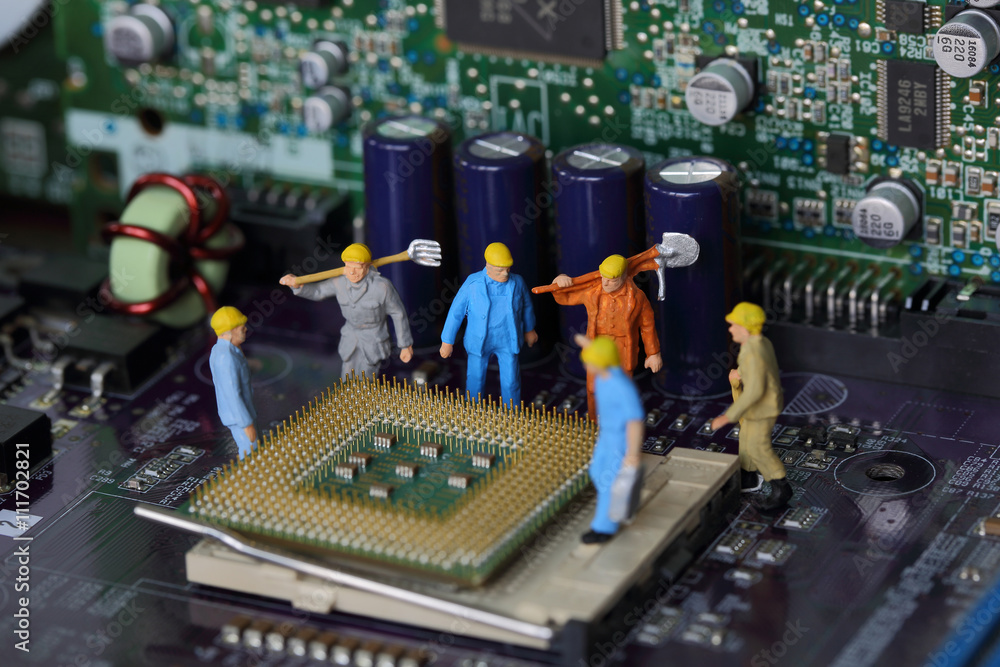 Selective focus of miniature engineer worker to fixed and repair ...