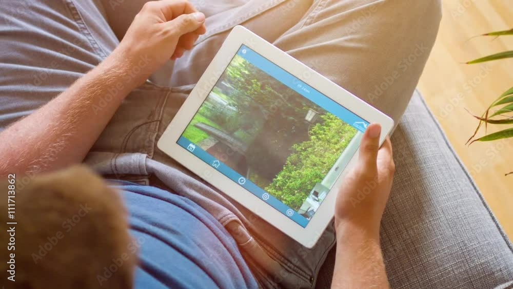 smart house, smart home automation, device with app icons. Man uses his ...