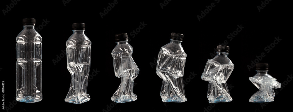 different steps of compressing a plastic bottle isolated on black ...